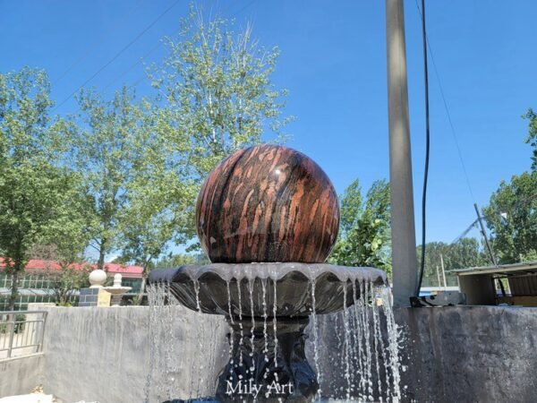 How Does a Rolling Ball Fountain Work and What Causes It to Stop?